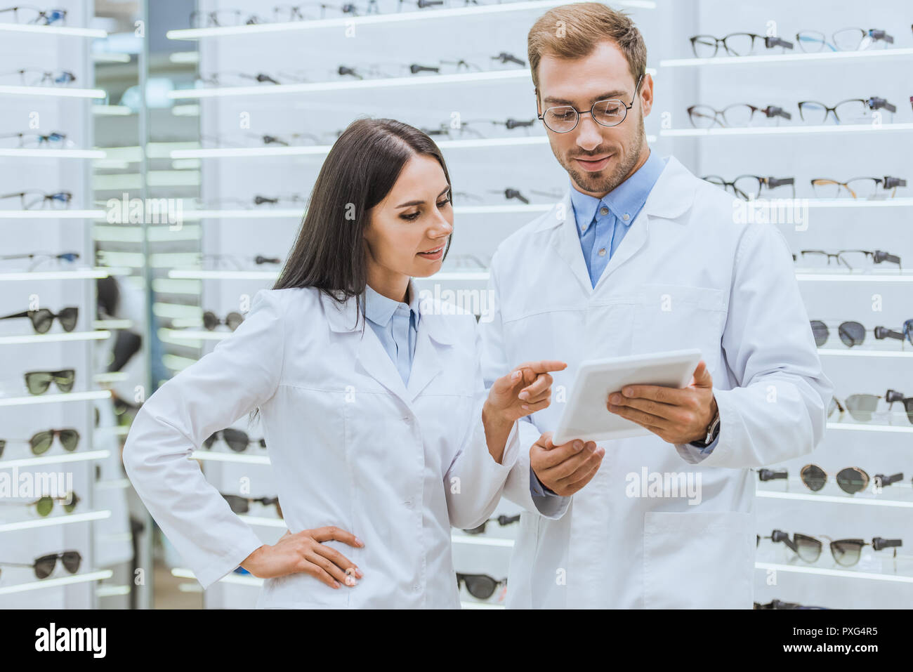 two optometrists working and using digital tablet in optica Stock Photo ...