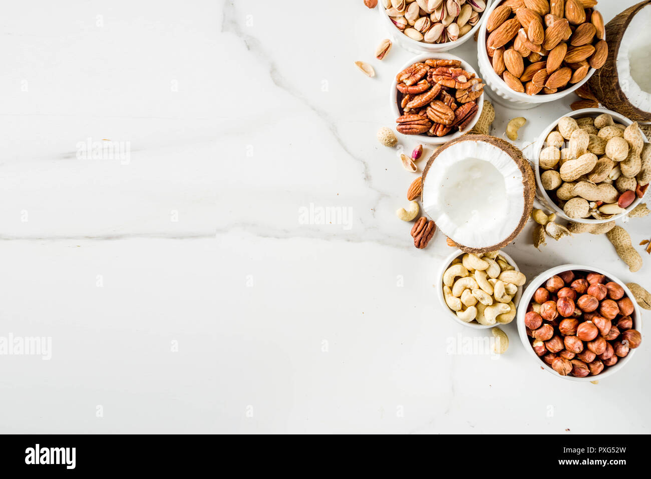Various types of nuts - walnuts, pecans, peanuts, hazelnuts, coconut ...