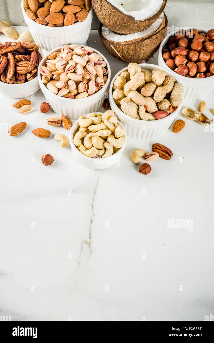 Various types of nuts - walnuts, pecans, peanuts, hazelnuts, coconut ...
