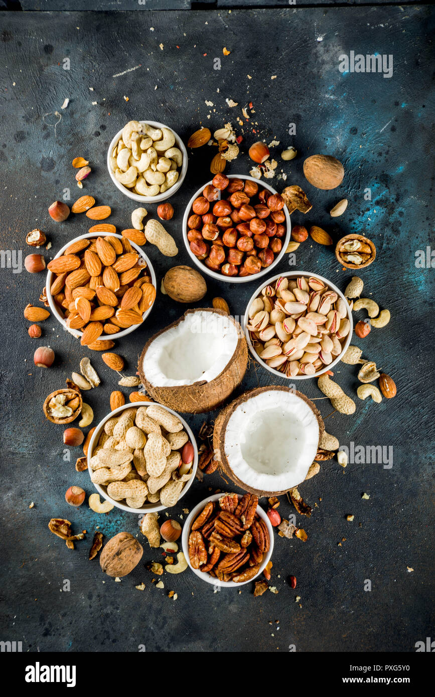 Various types of nuts - walnuts, pecans, peanuts, hazelnuts, coconut ...