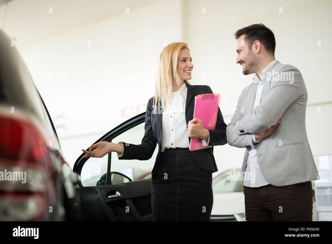 Portrait of happy customer buying new car Stock Photo - Alamy