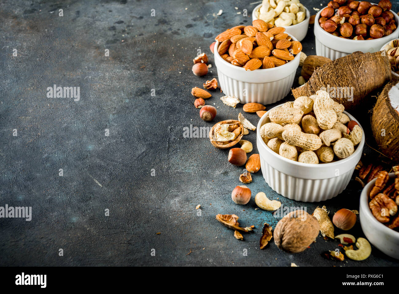 Various types of nuts - walnuts, pecans, peanuts, hazelnuts, coconut ...
