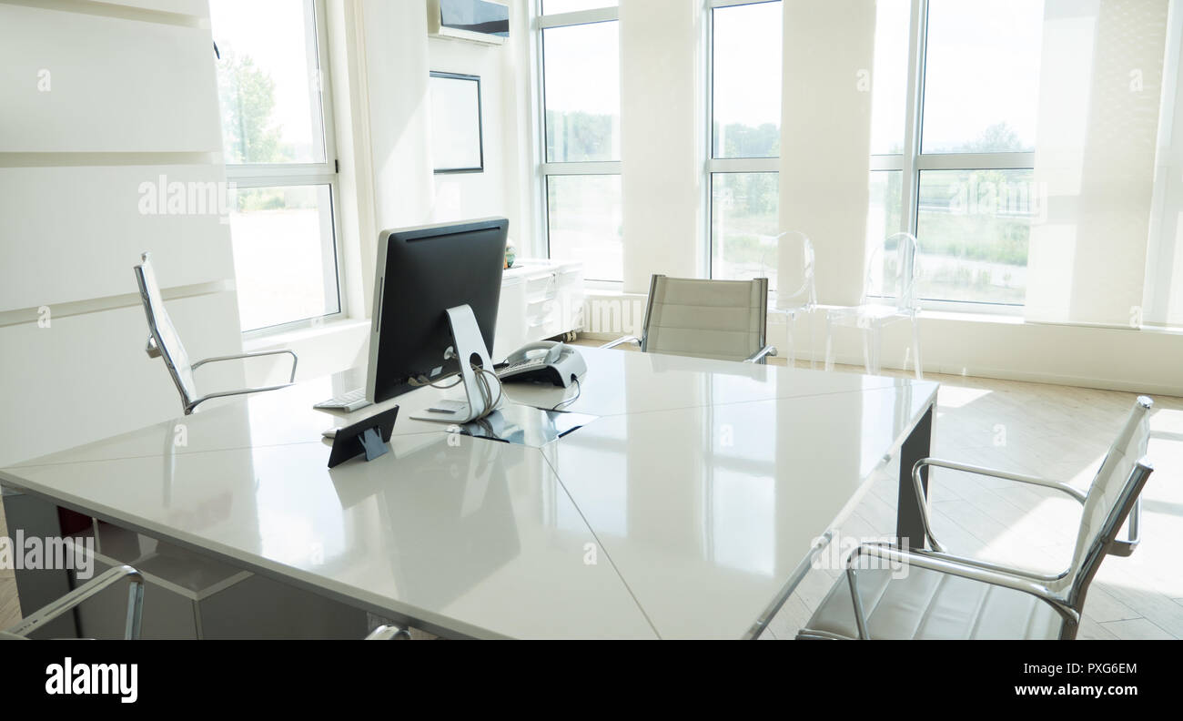 Modern empty elegant office with windows and workplaces Stock Photo - Alamy