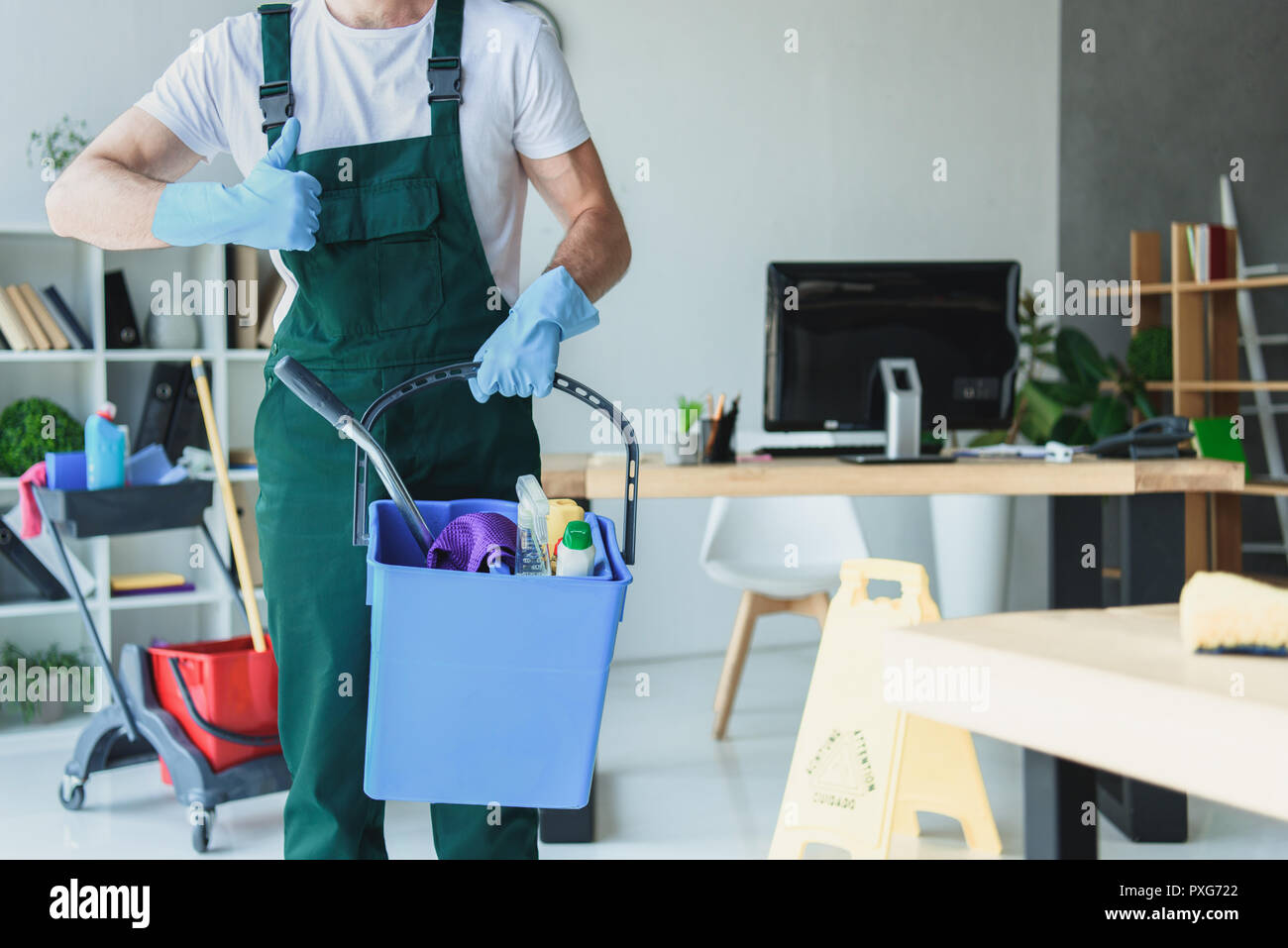cropped shot of professional cleaner holding bucket with cleaning ...