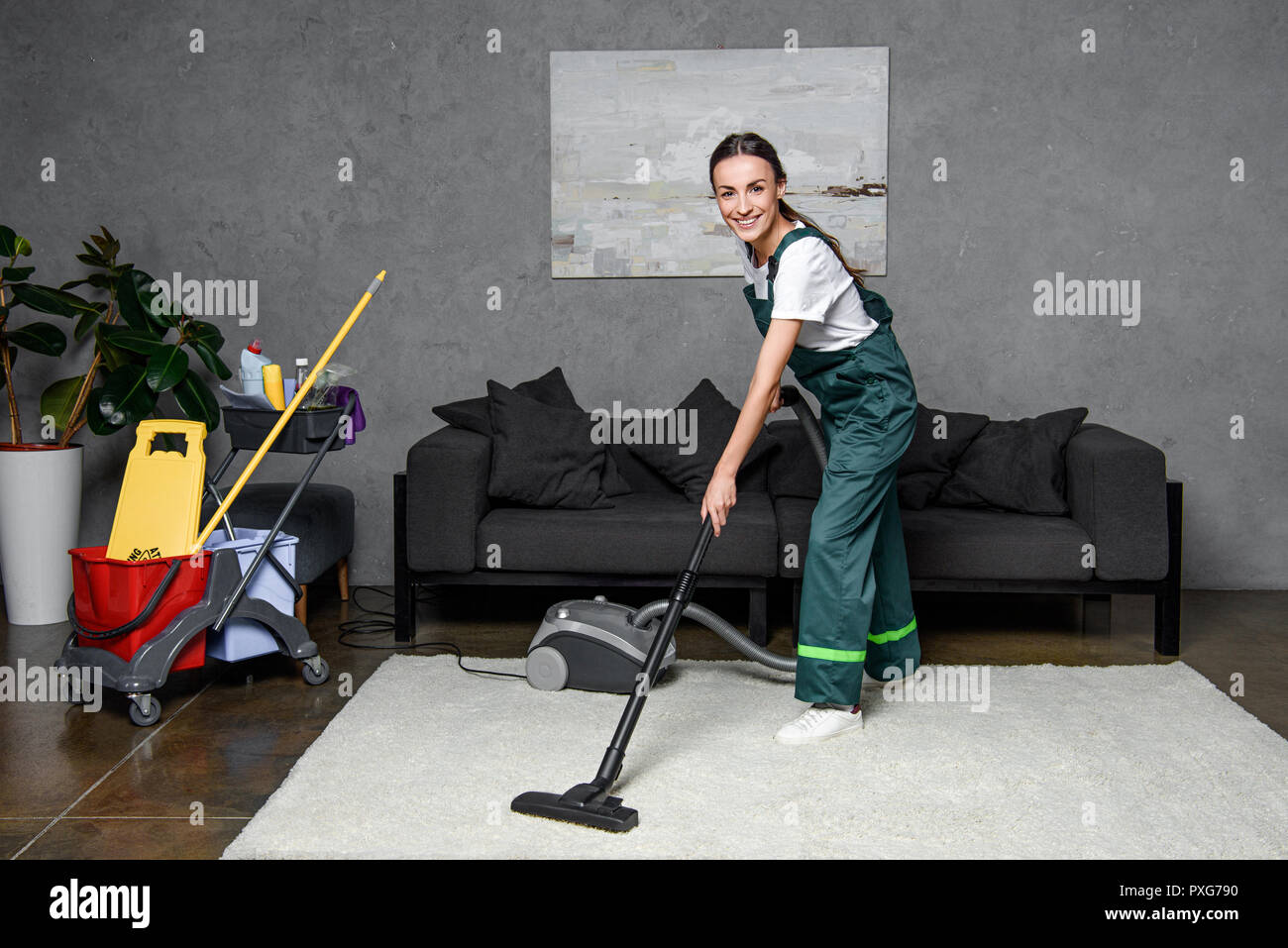 Happy young female cleaning hi-res stock photography and images - Alamy