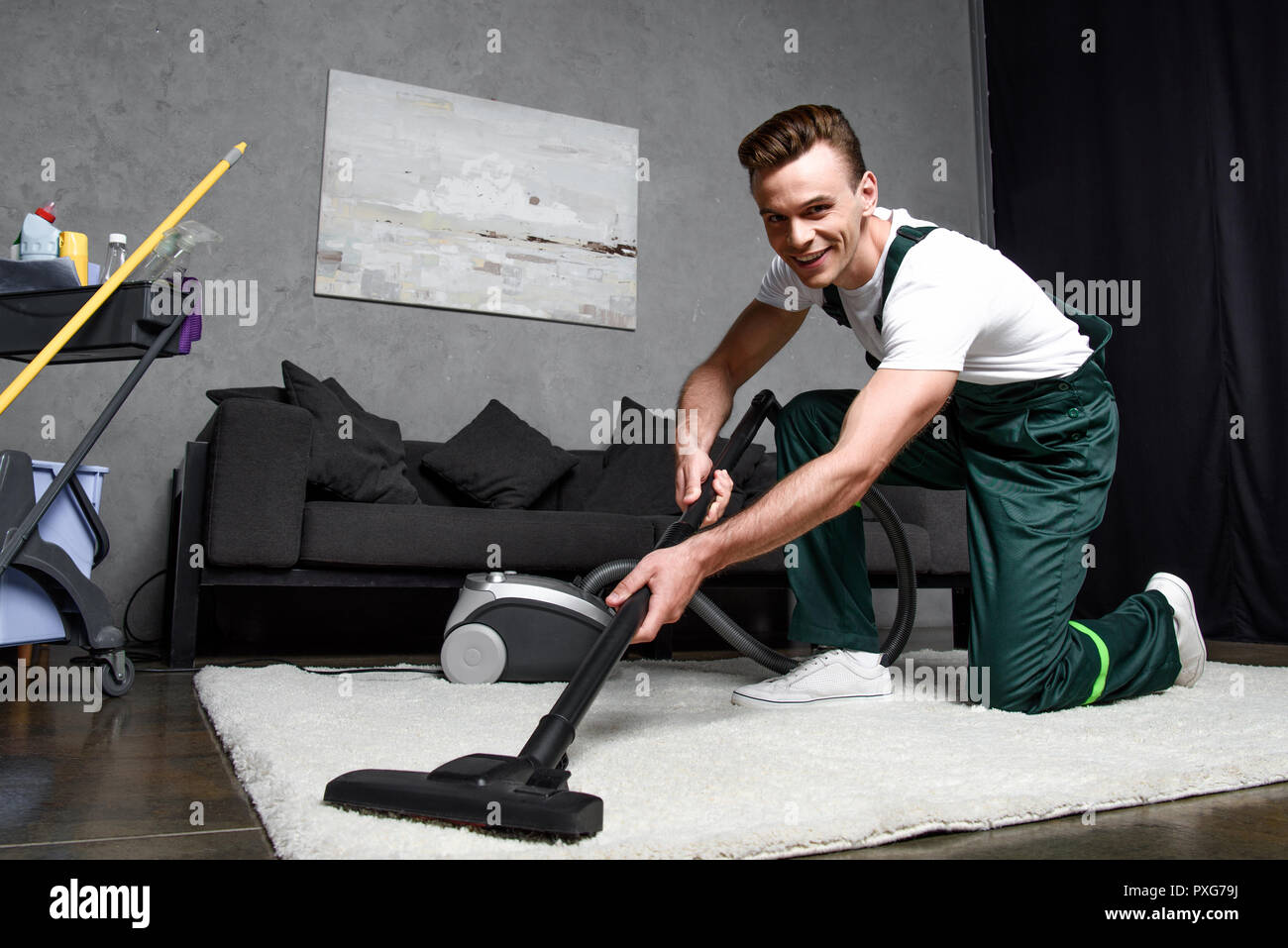 Adult male using vacuum cleaner hi-res stock photography and images - Alamy