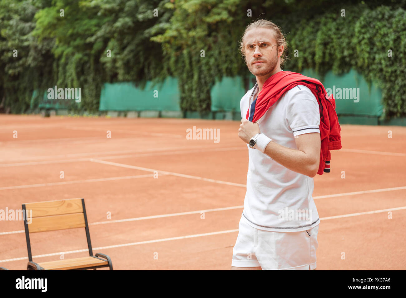 handsome old fashioned tennis player on court Stock Photo - Alamy