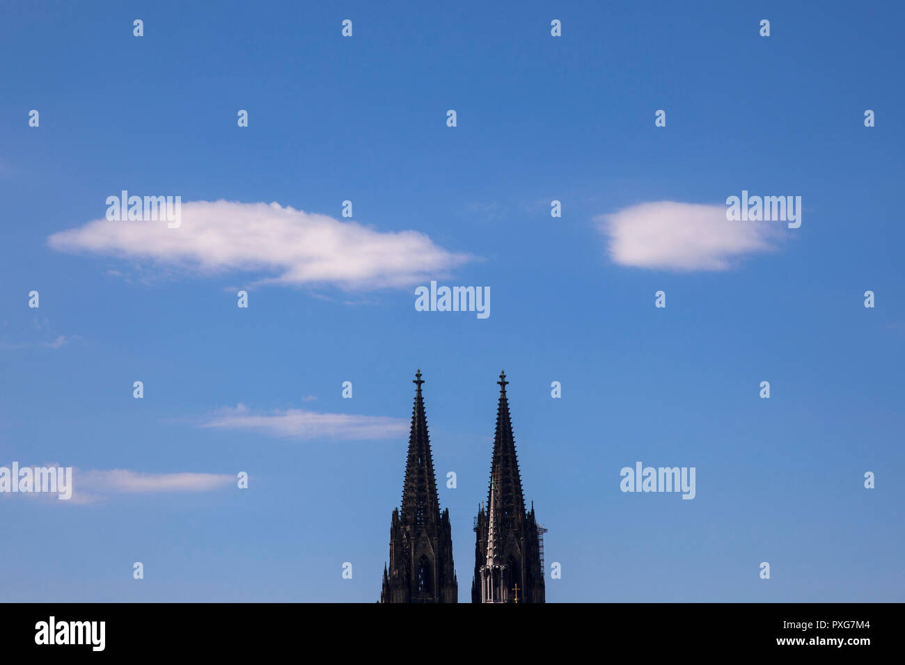 clouds above the steeples of the cathedral, Cologne, Germany. Wolken ...