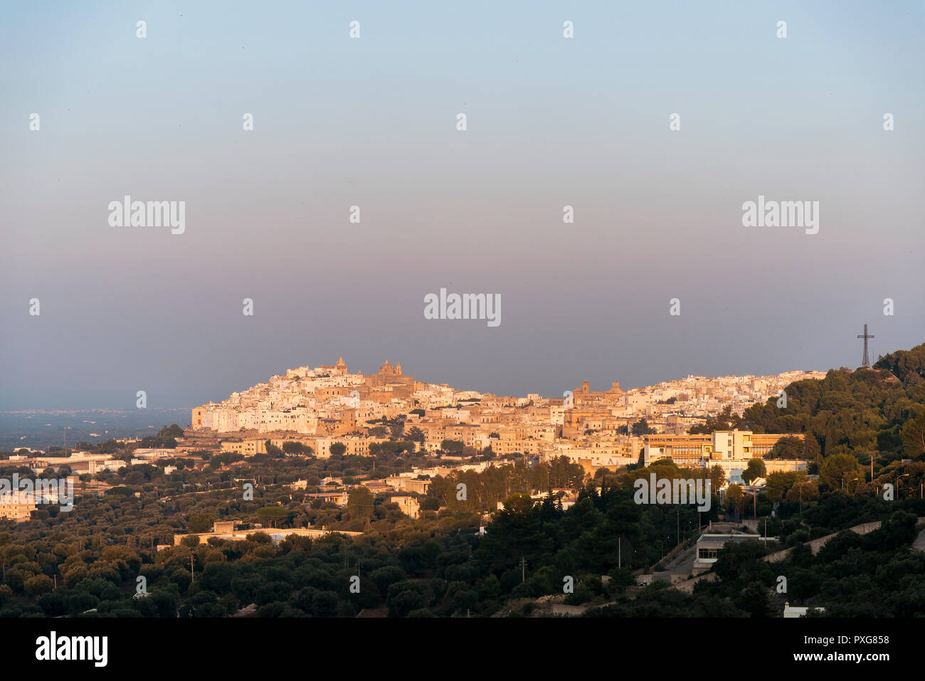 Panoramic view of the medieval white village of Ostuni at sunset Stock ...