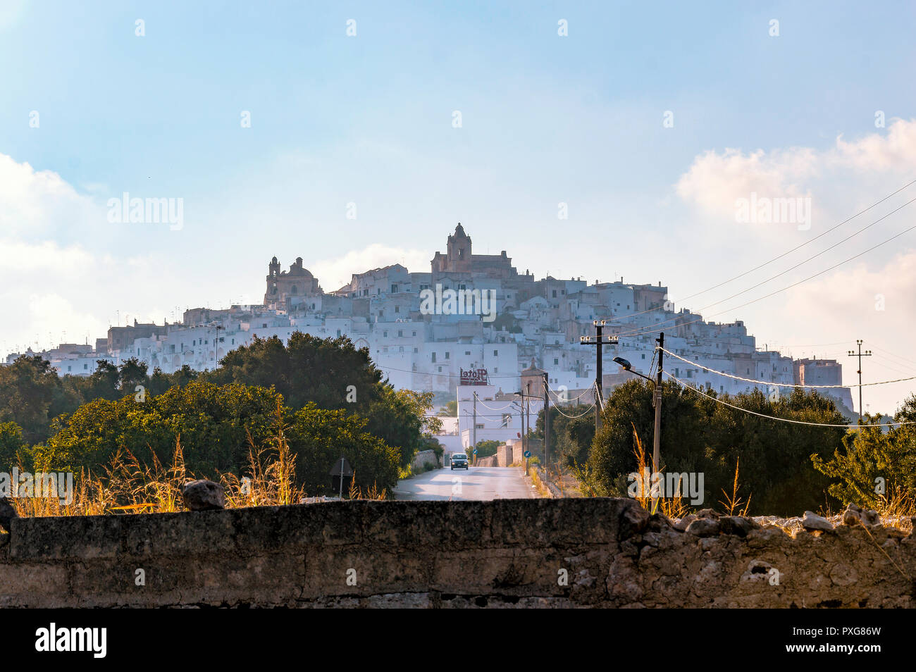 Panoramic shape of the medieval white village of Ostuni at sunset Stock ...
