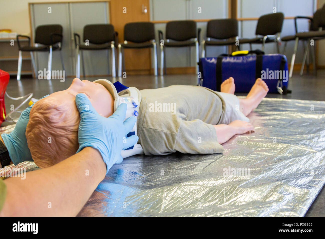 Human hands stabilisations the neck from a medical training puppet for ...