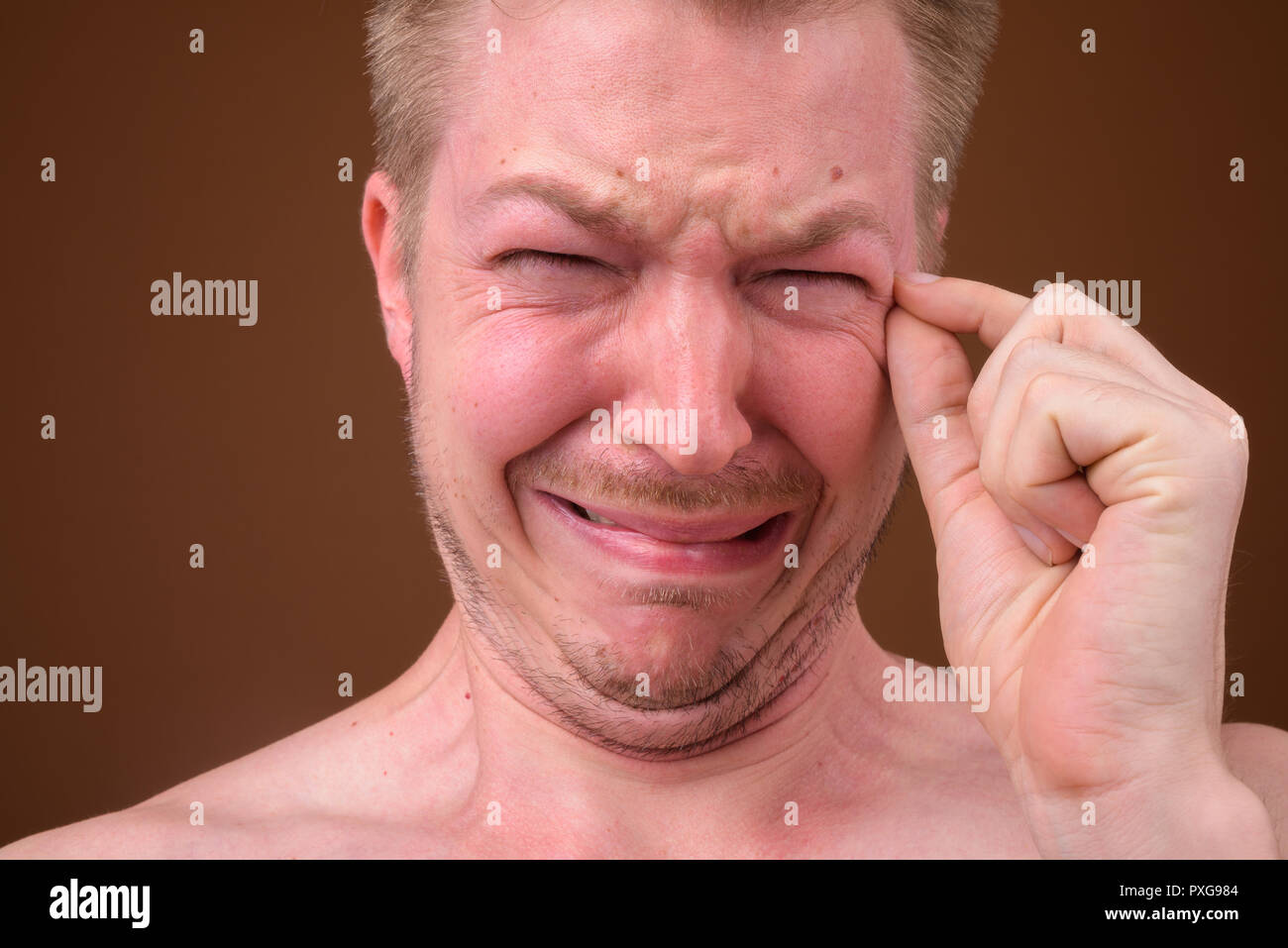 Face of young man with double chin crying Stock Photo - Alamy