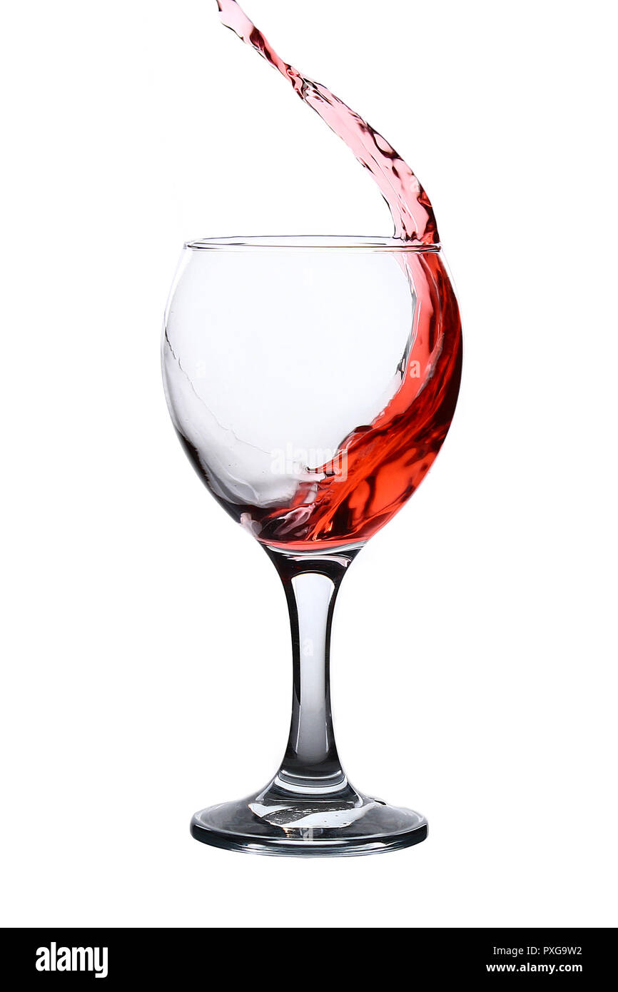 Splash of wine in a wineglass on a white background Stock Photo - Alamy