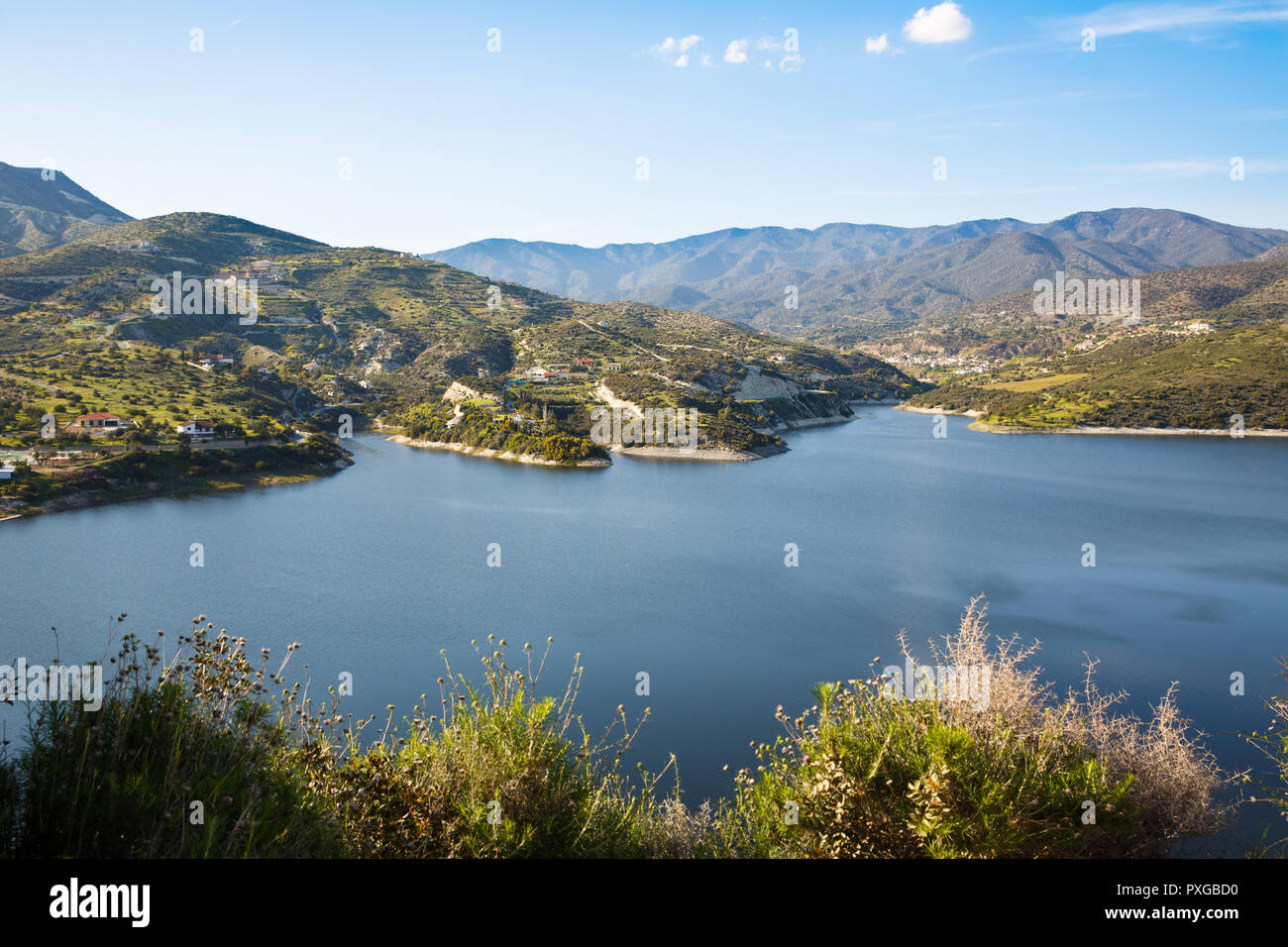 Cyprus landscape with mountains, lake and village Stock Photo - Alamy