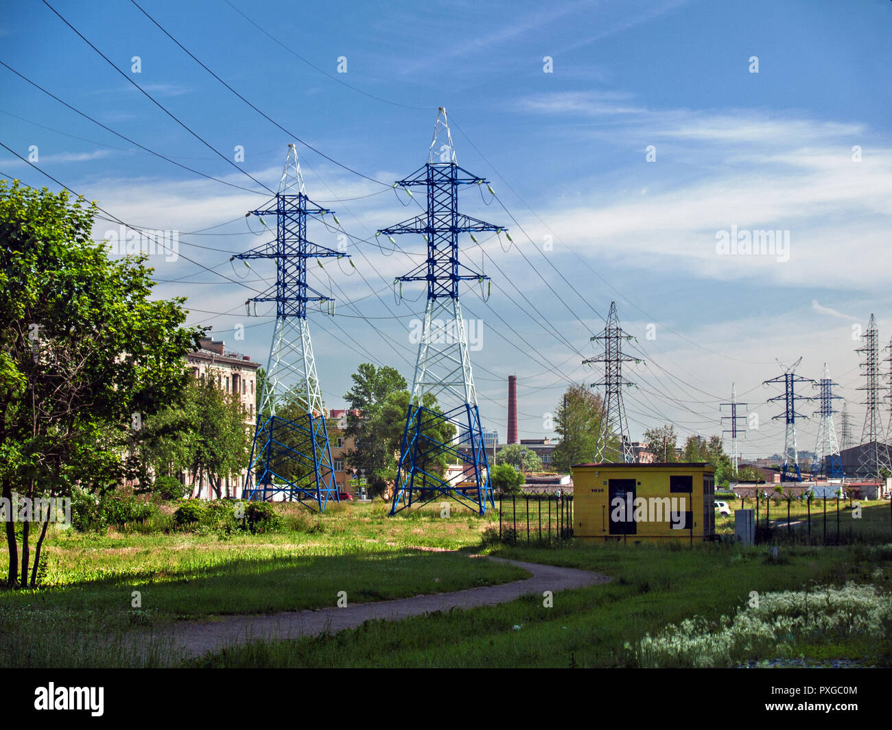 A line of power transmission structures of various shapes and different ...