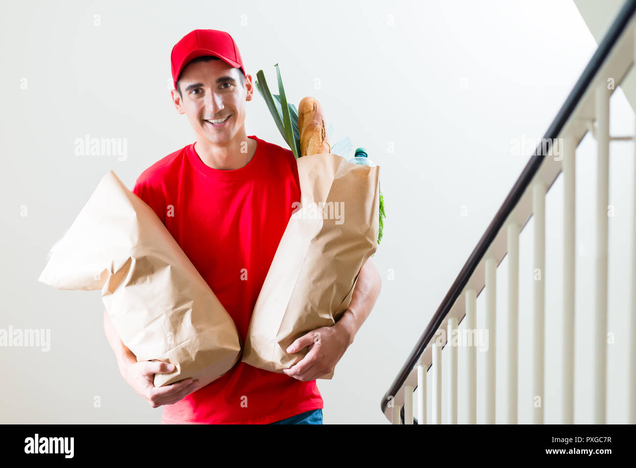 Person carrying grocery bags hi-res stock photography and images - Alamy