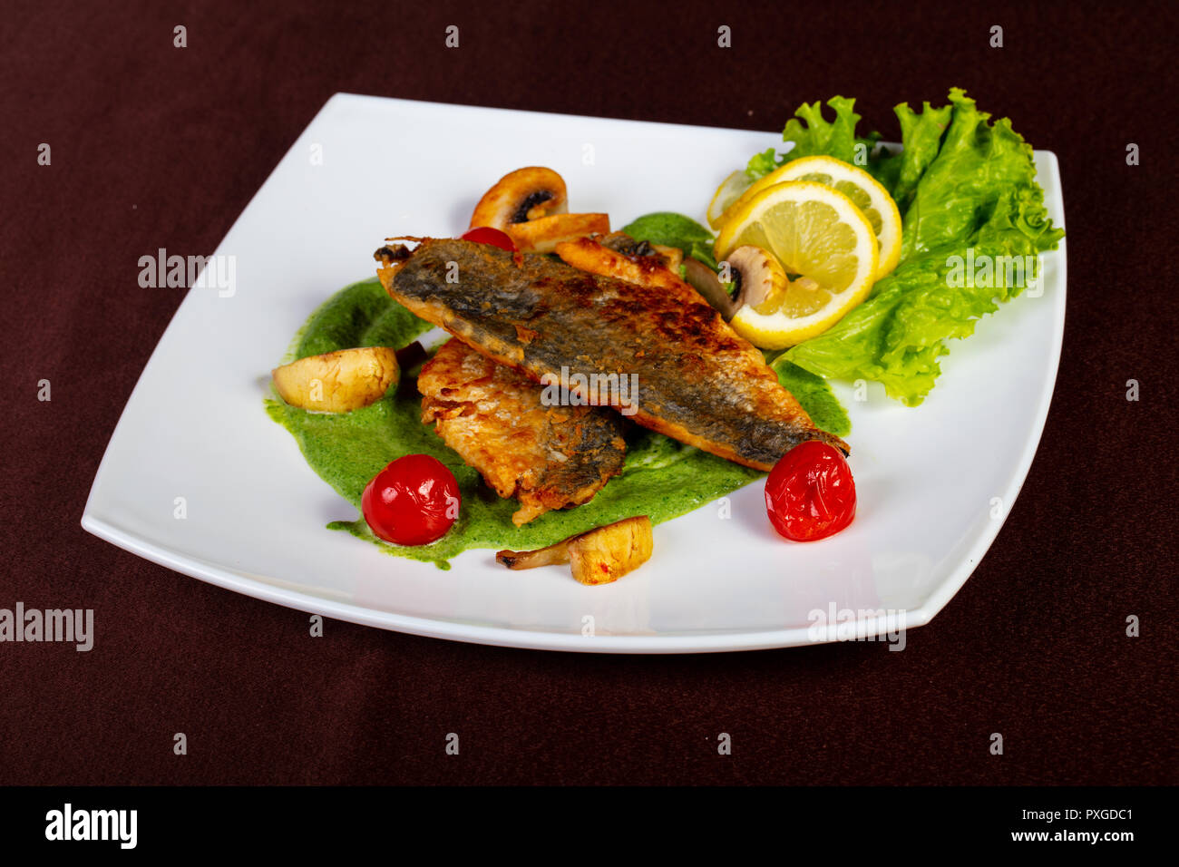 Roasted Dorado fish fillet with sauce Stock Photo - Alamy