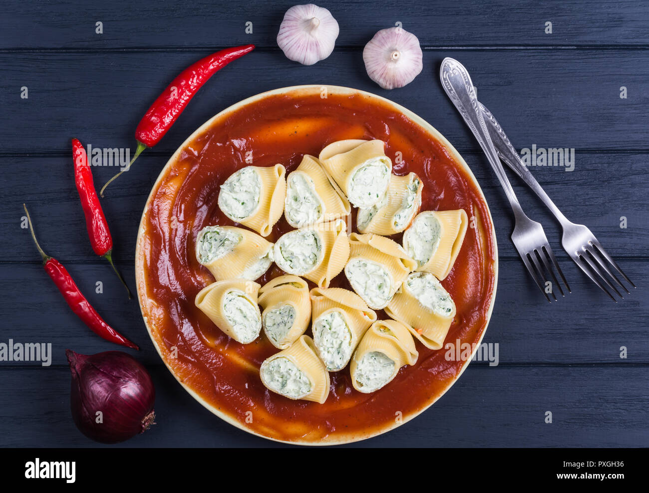Delicious lumaconi pasta meal with cheese and tomato sauce Stock Photo ...