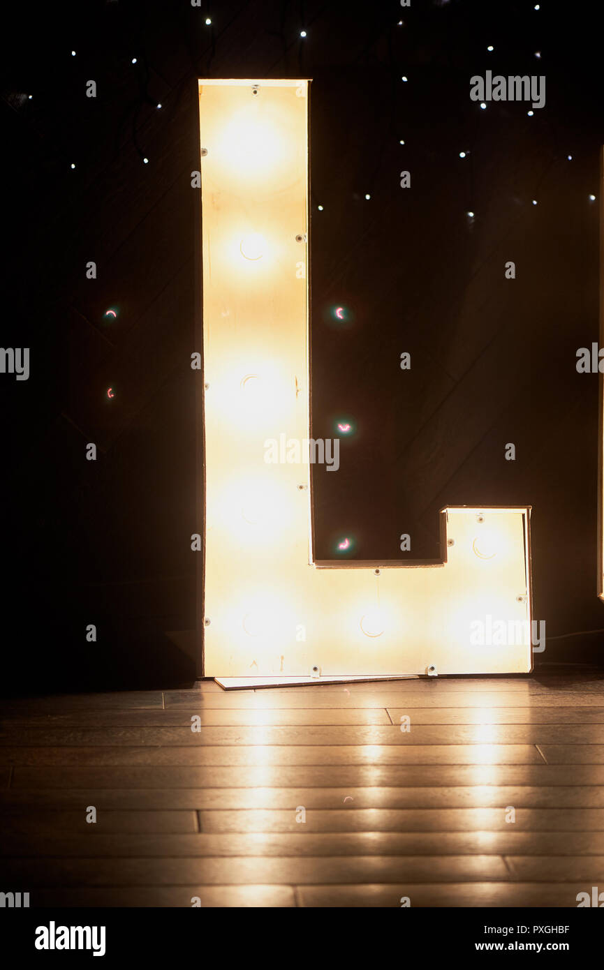 Glowing letters l in the design of a party night club Stock Photo - Alamy