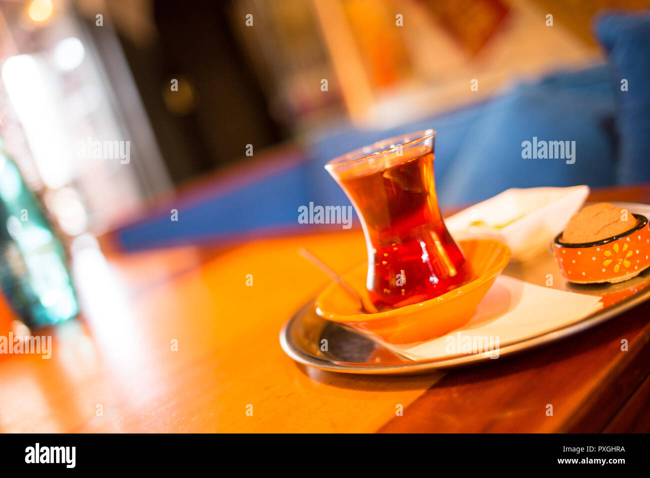 Turkish tea in traditional glass on tray closeup. Istanbul cafe with ...