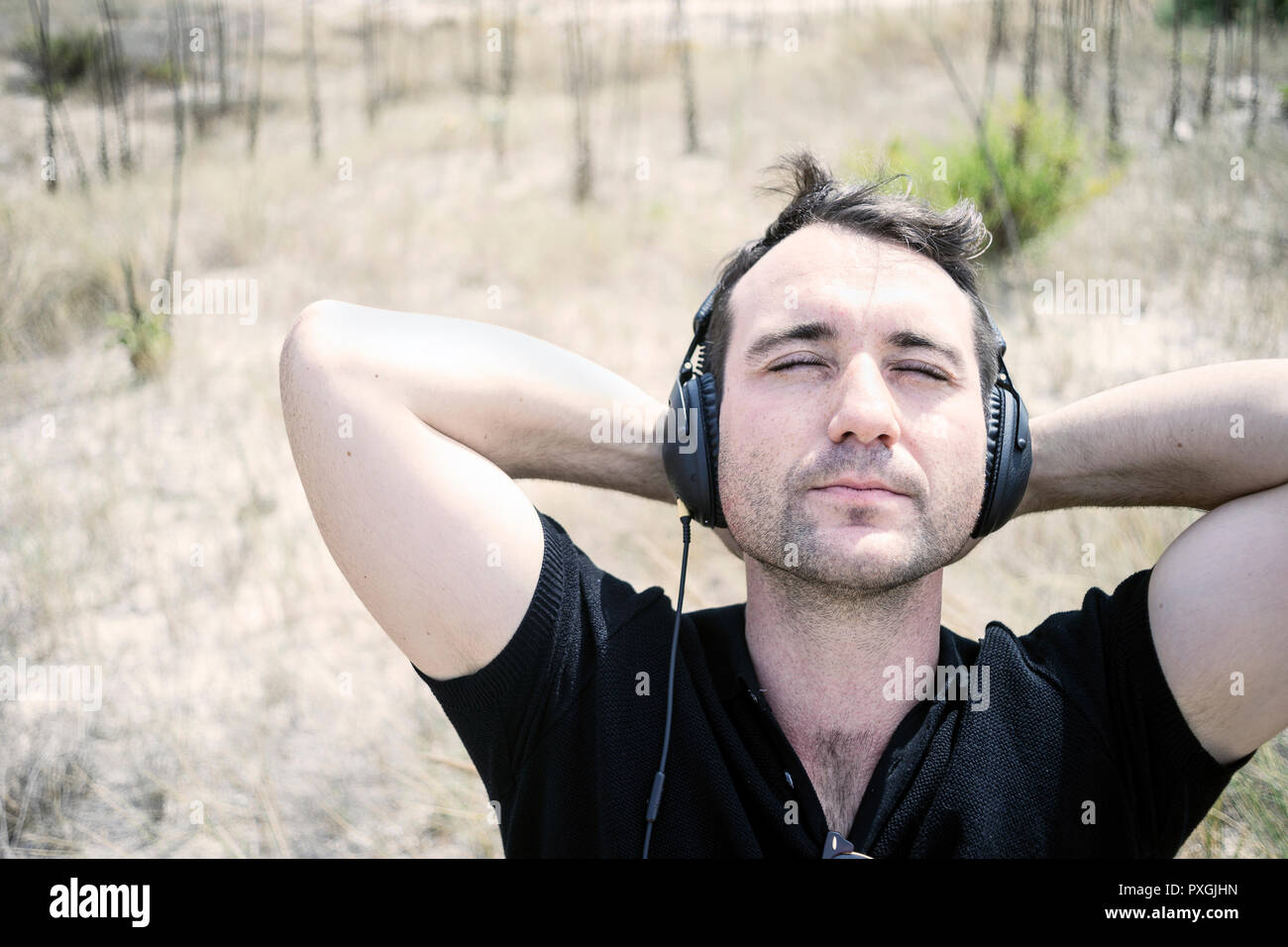 Young black man wearing headphones hi-res stock photography and images - Alamy