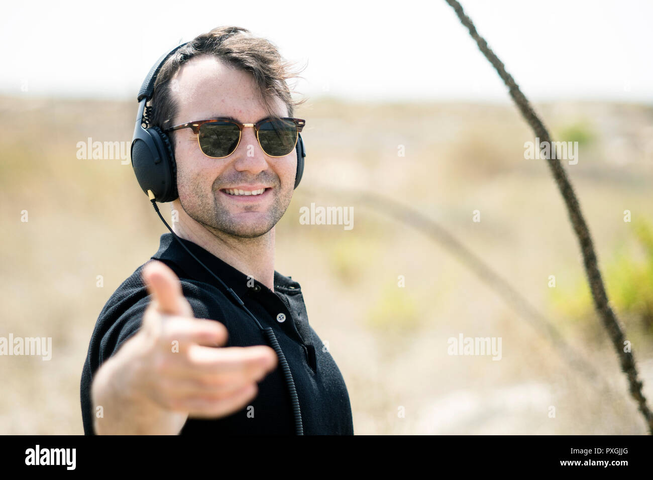 Young handsome happy man headphones hi-res stock photography and images - Alamy