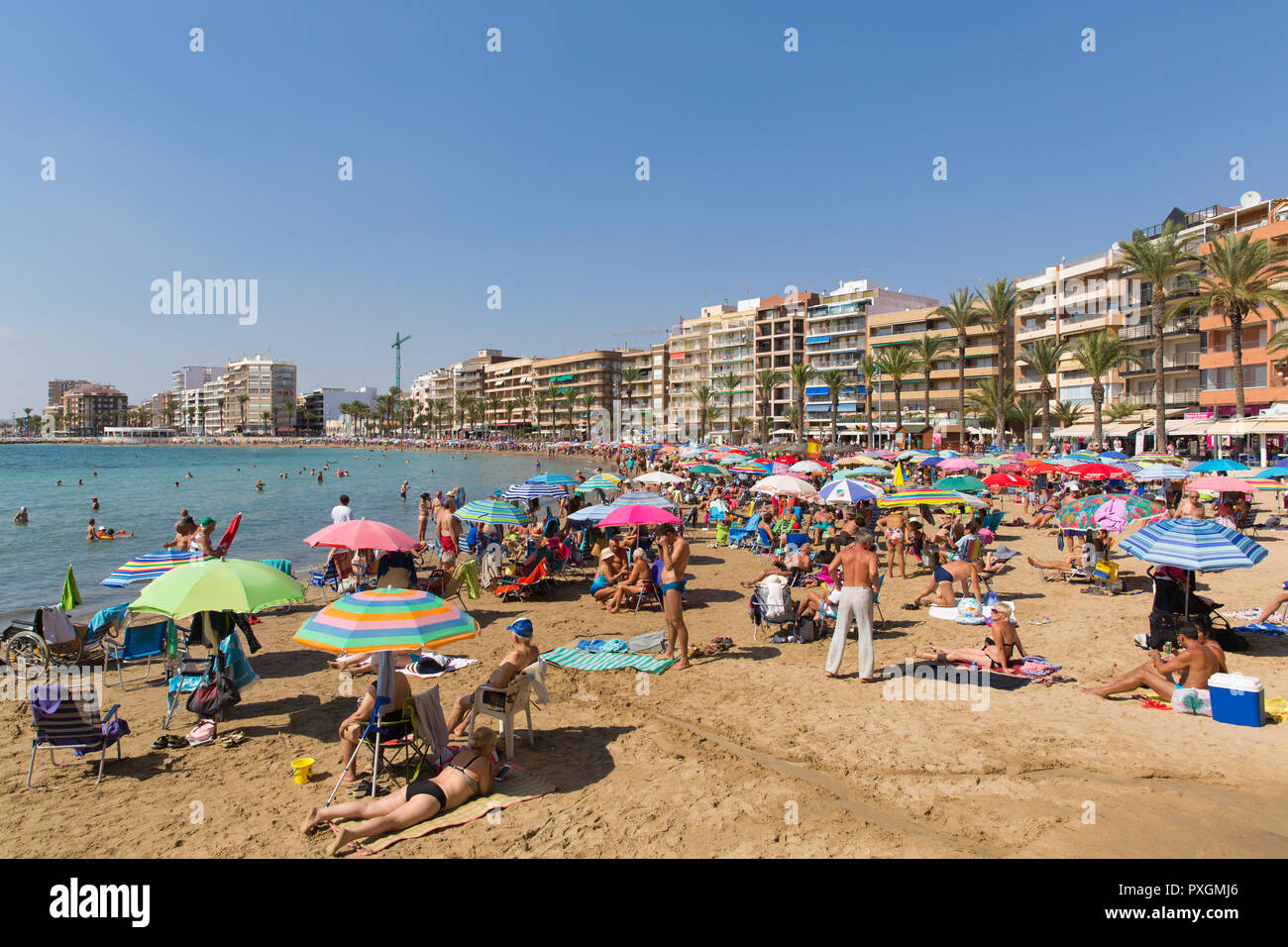 Torrevieja Spain busy crowded beach with tourists and holidaymakers in ...