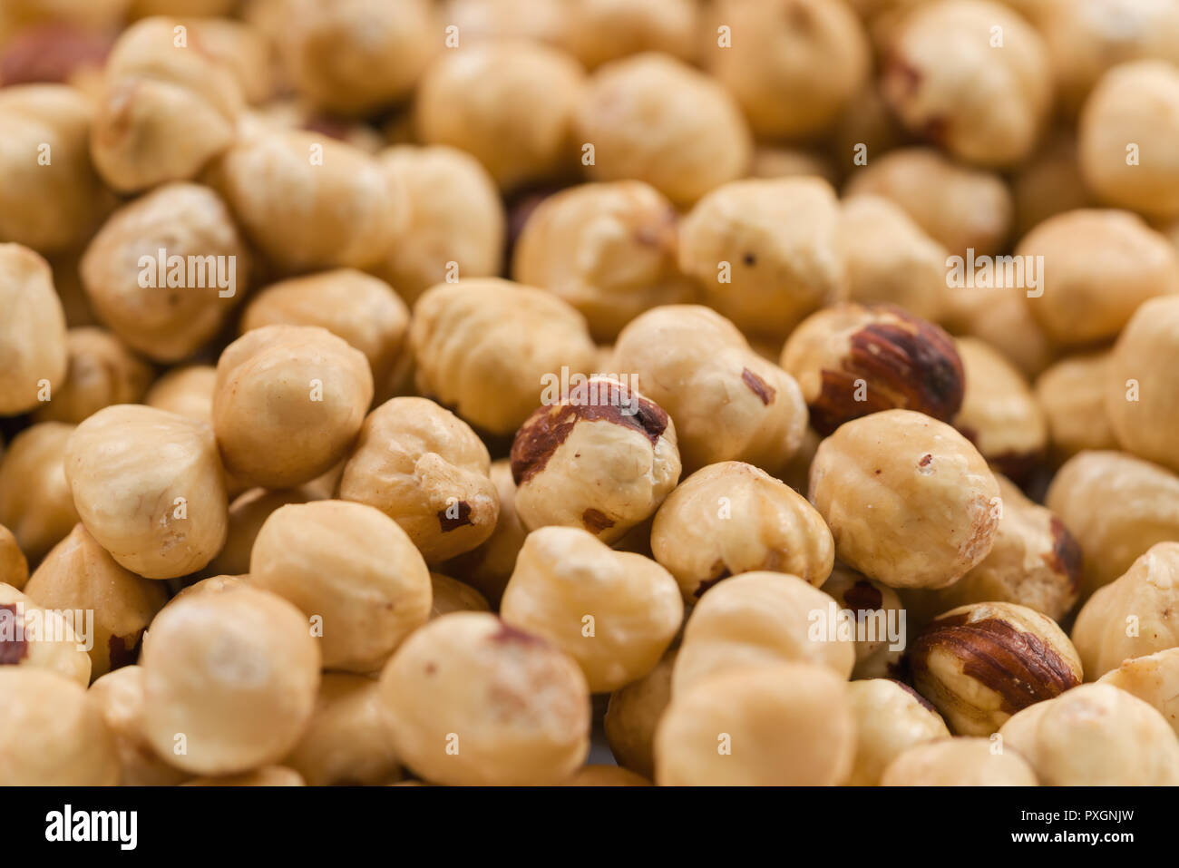 roasted hazelnuts background Stock Photo - Alamy