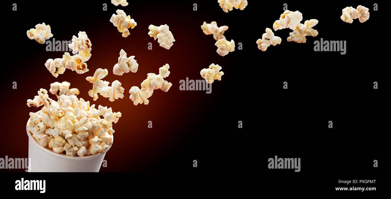 Popcorn flying out of cardboard box. Isolated on black background Stock ...