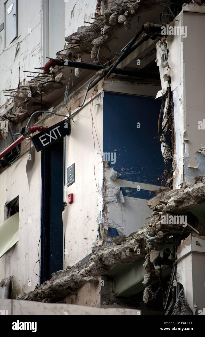 Exit sign on partially demolished building Stock Photo - Alamy
