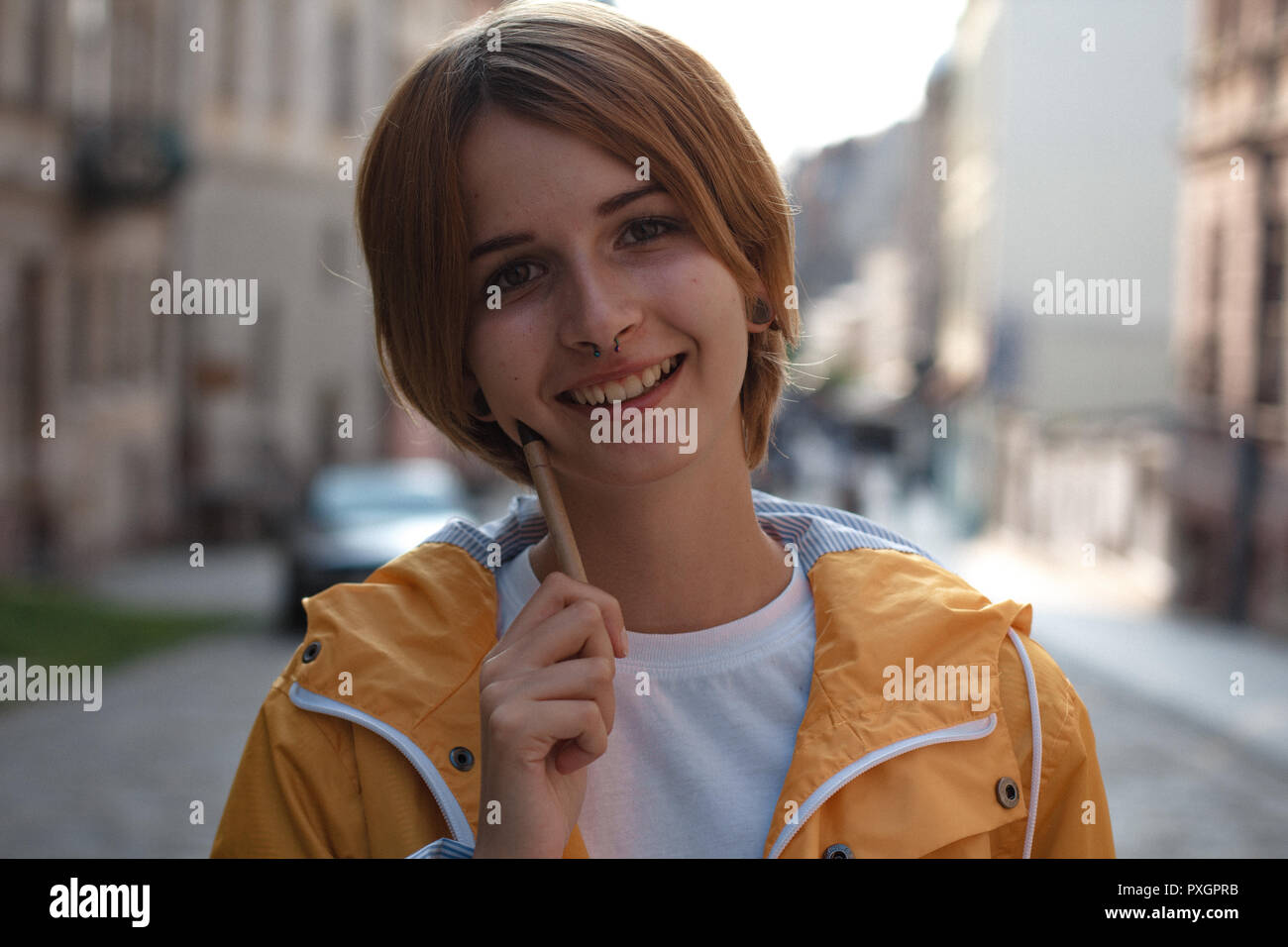 Romantic beautiful girl writing poems while walking Stock Photo - Alamy