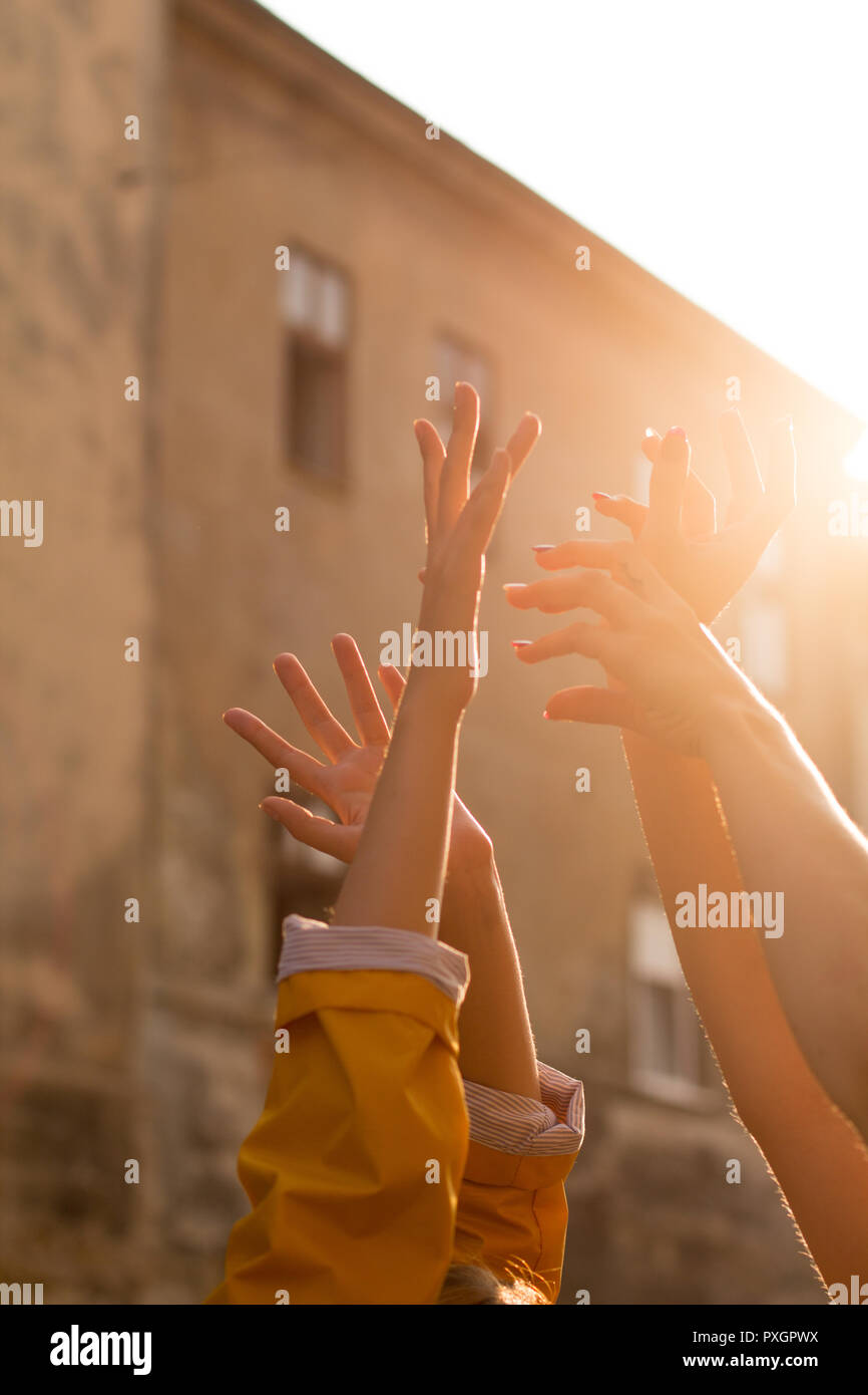 female hands raised while walking Stock Photo - Alamy