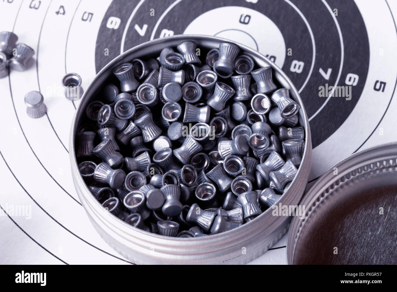 A box of lead shot for shotguns on top of cardboard targets Stock Photo ...