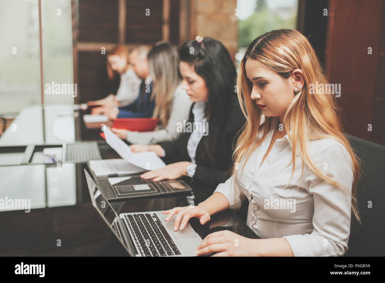 Creative business people working on business project in office Stock ...