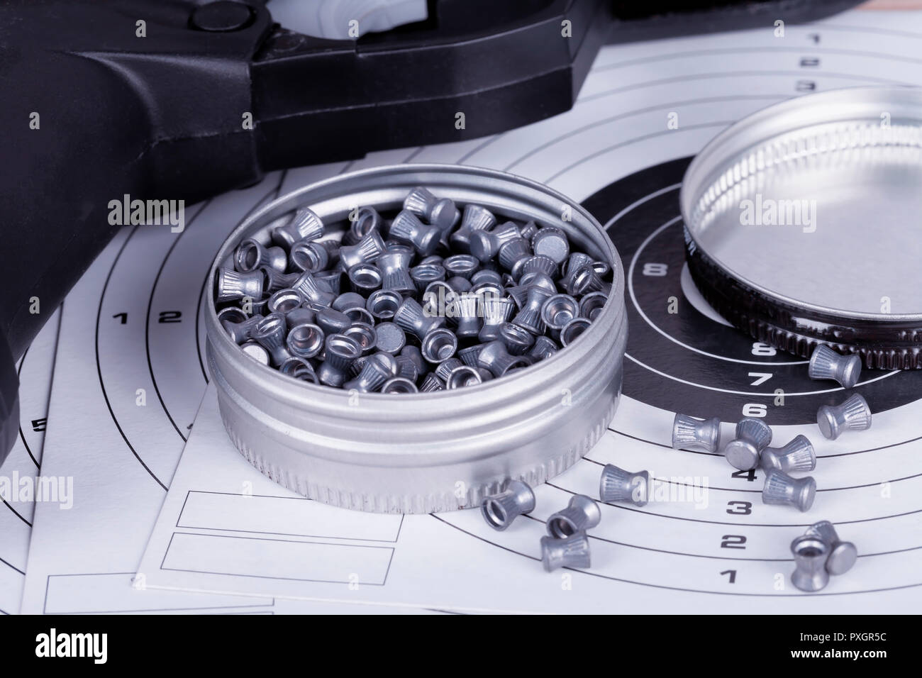 A box of lead shot for shotguns on top of cardboard targets Stock Photo ...