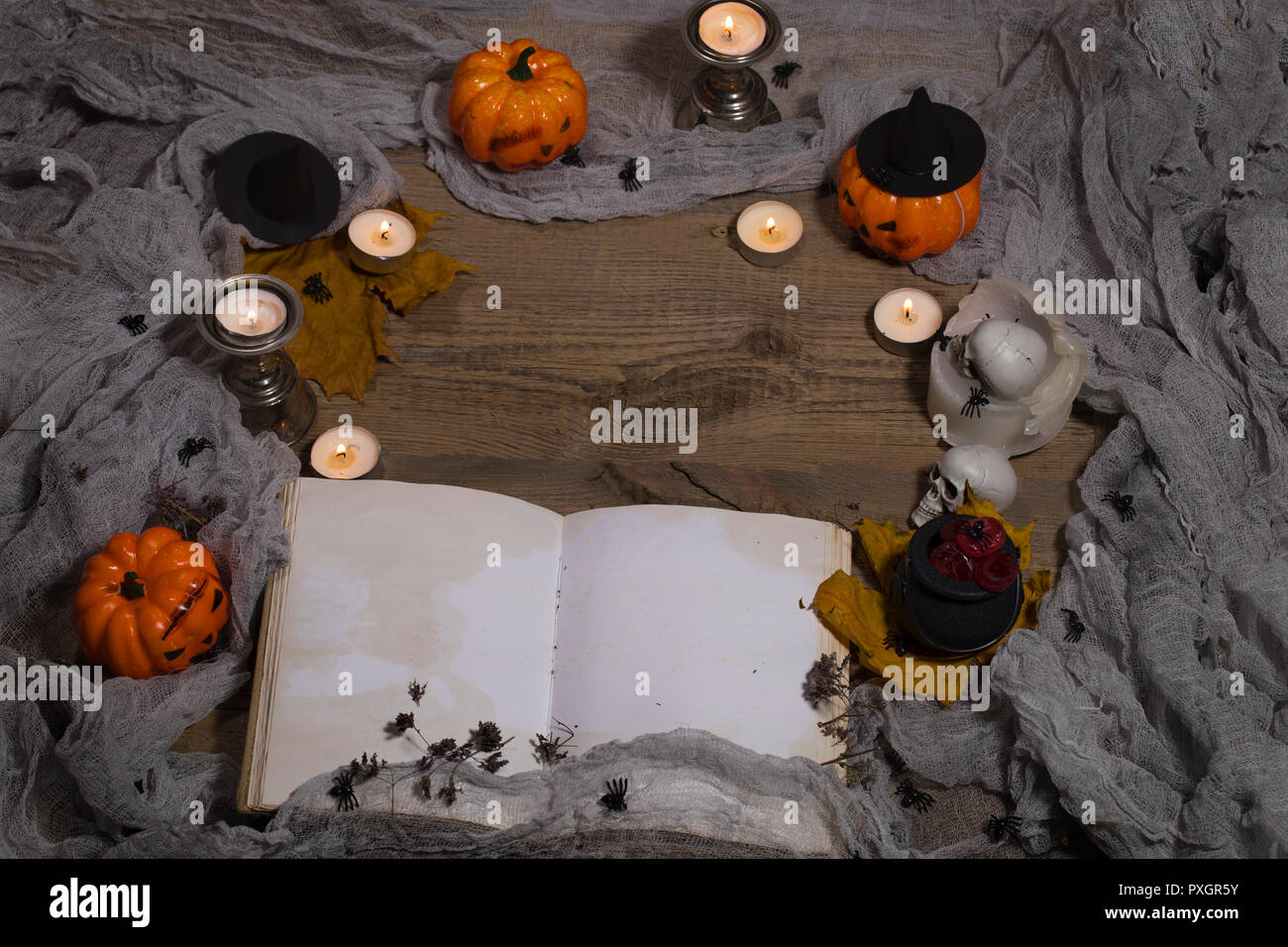 Halloween background. Opened book of bewithcment.Overhead perspective ...