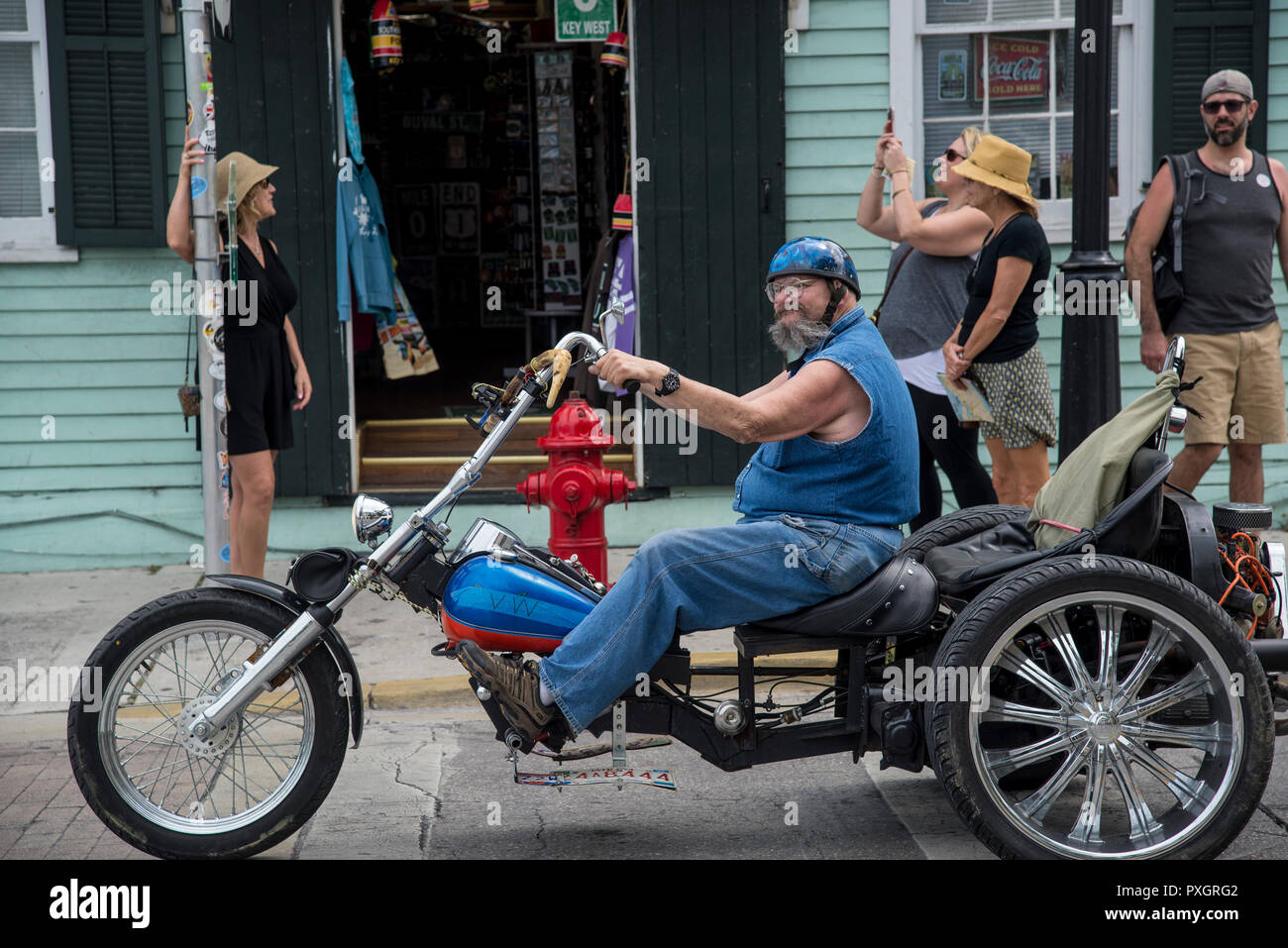 middle-aged man on a very big and fancy motorcycle in Key West Florida ...
