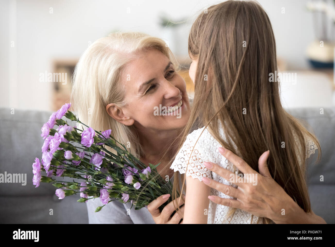Cute girl grandmother present hi-res stock photography and images - Alamy