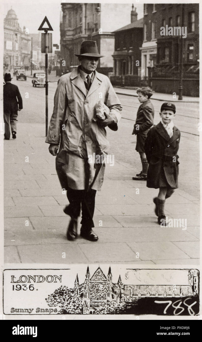 Gent in Raincoat and young schoolboy (his son?) - London Stock Photo ...