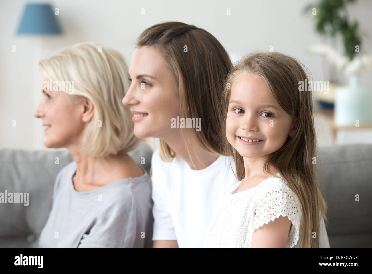 Three generations of women with small girl posing for picture Stock ...