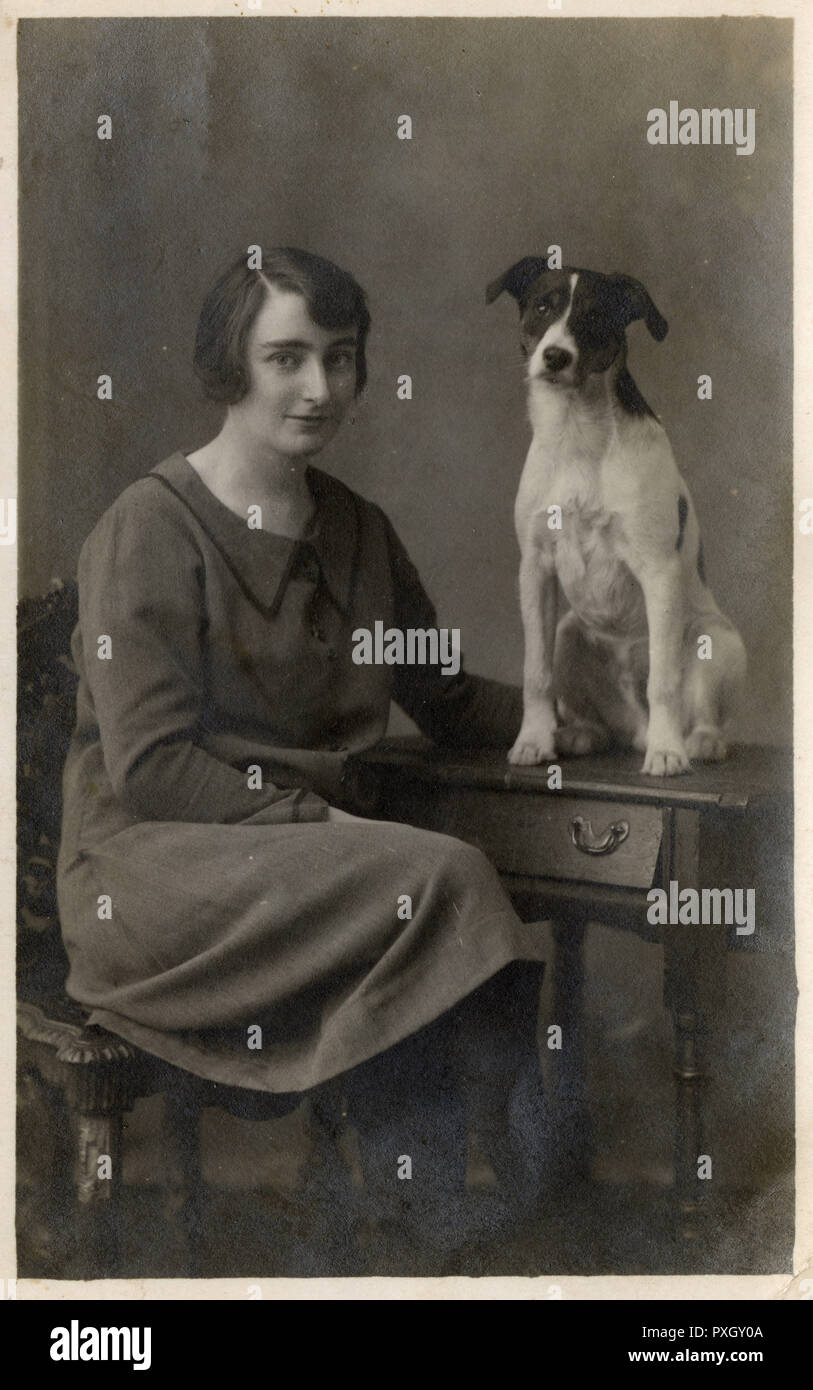 A lady and her dog pose for a studio portrait Stock Photo - Alamy