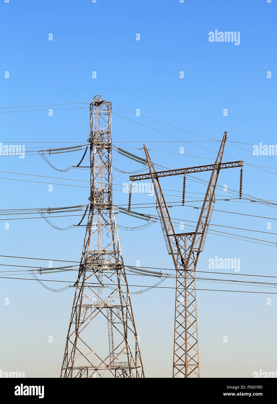 Intermediate anchor poles of power lines with high voltage wires Stock ...