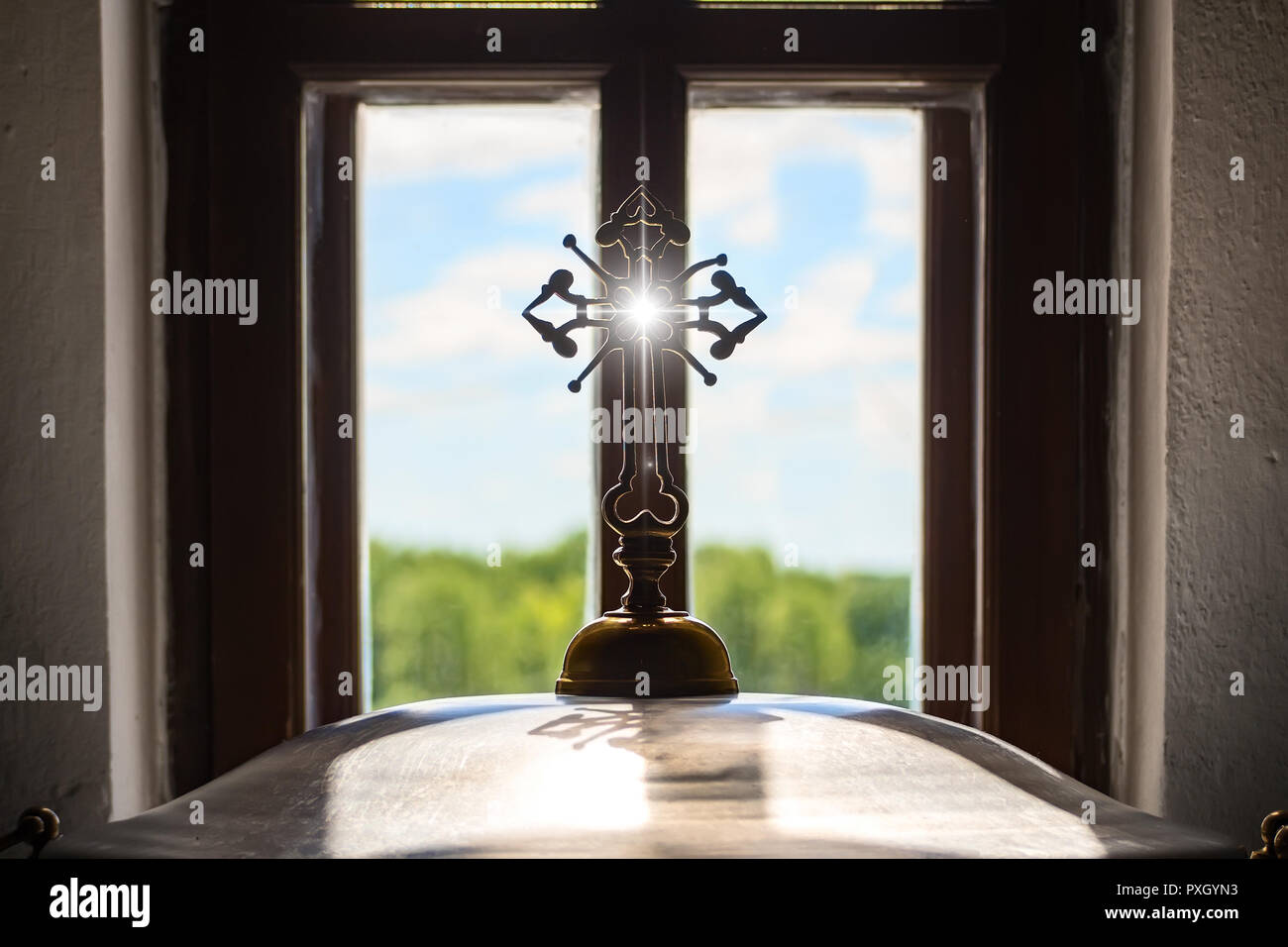 Church orthodox cross opposite window landscape sun rays blue sky green ...