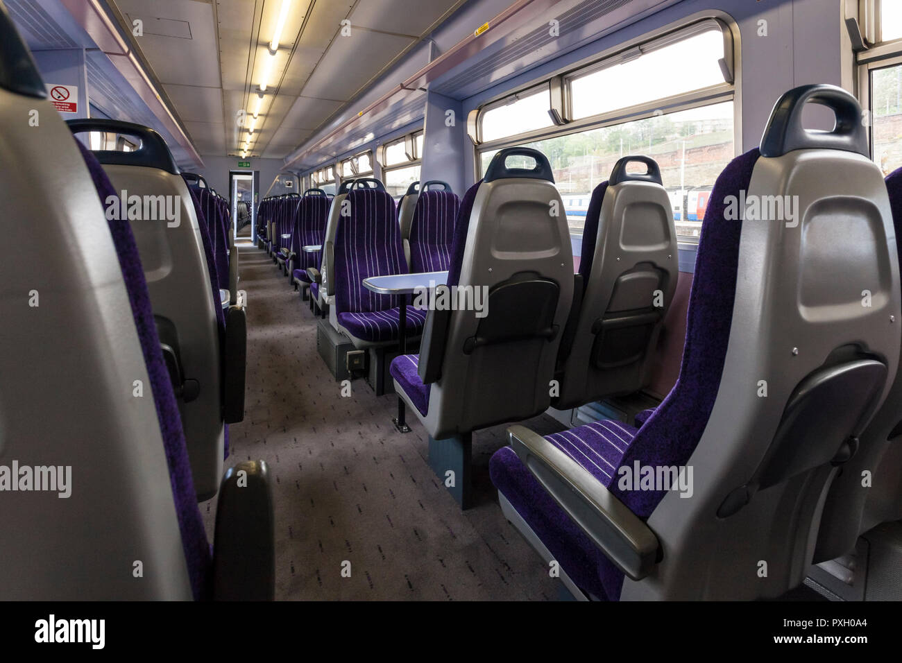 Seating inside an empty Northern railway carriage interior, England, UK ...