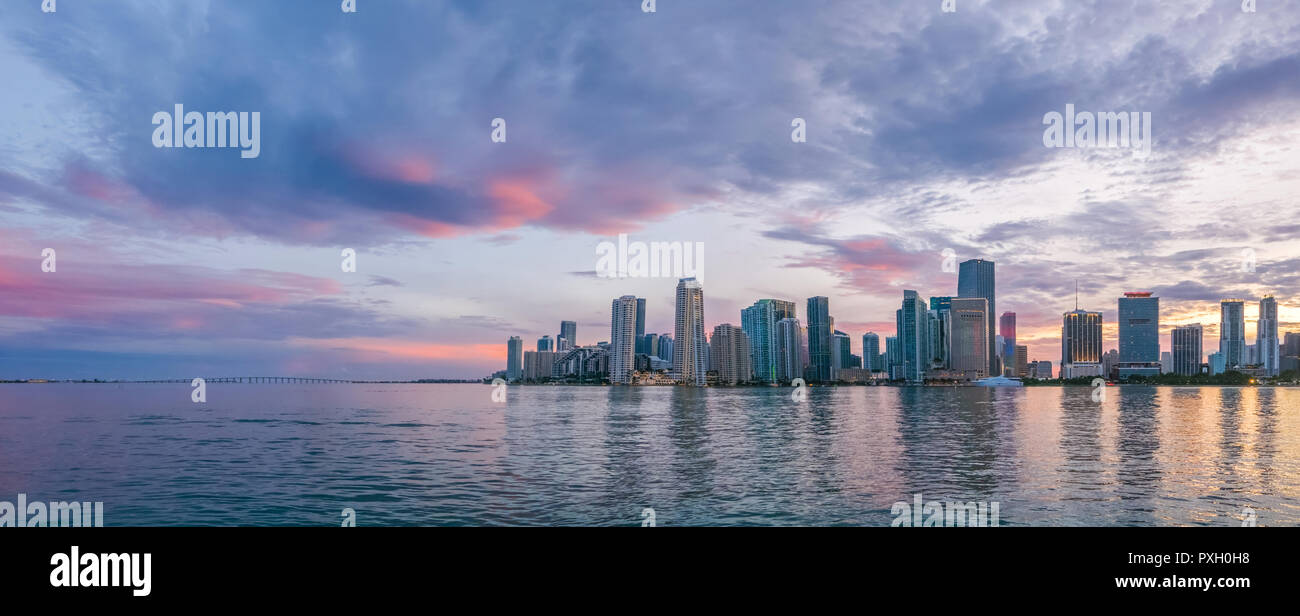 Miami, wide panorama of urban skyline at beautiful sunset, vivid and ...