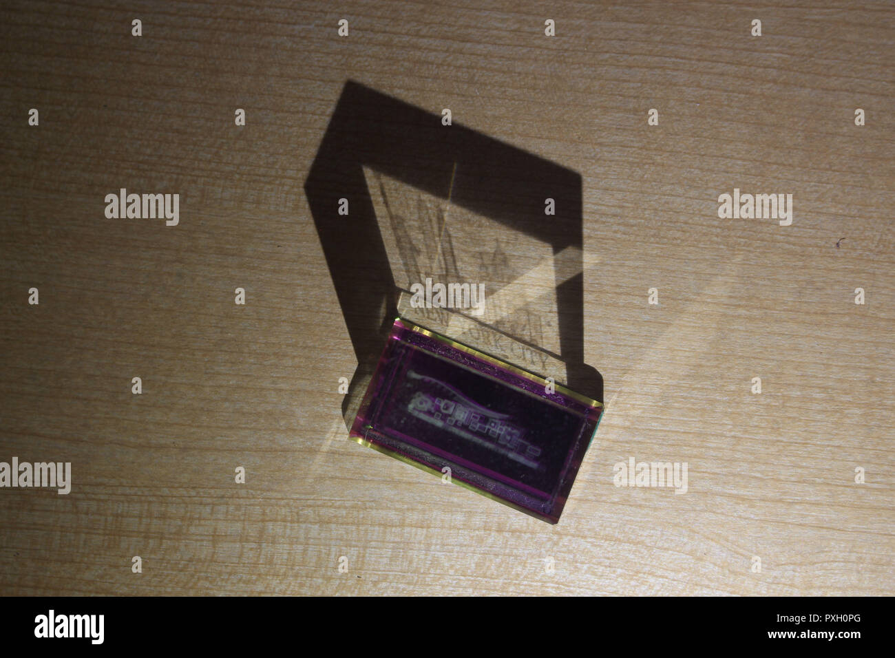 A glass cube with New York City landscape etched inside placed on a ...