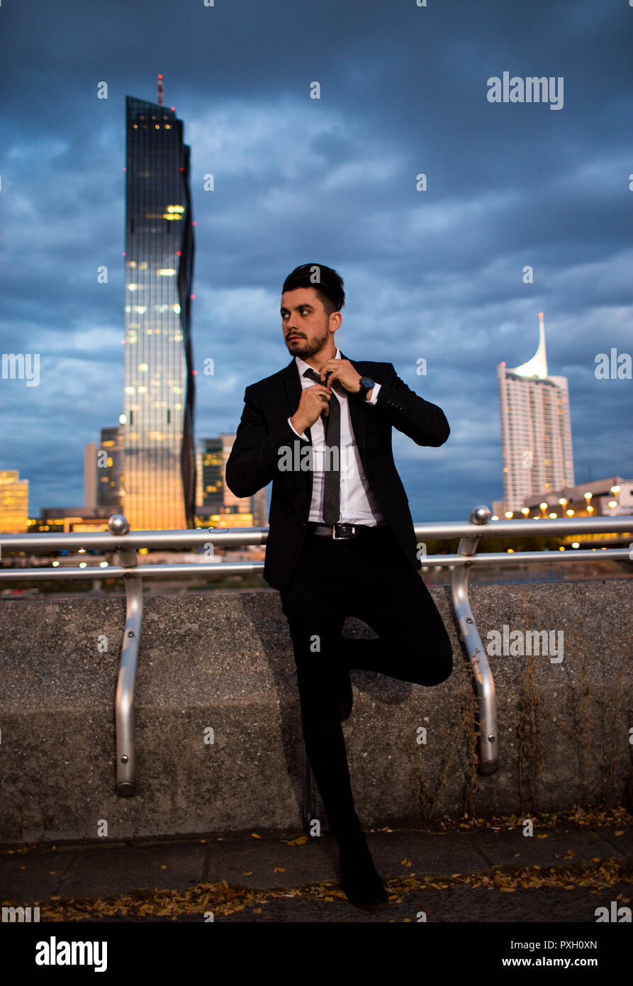 Man fixing tie hi-res stock photography and images - Alamy