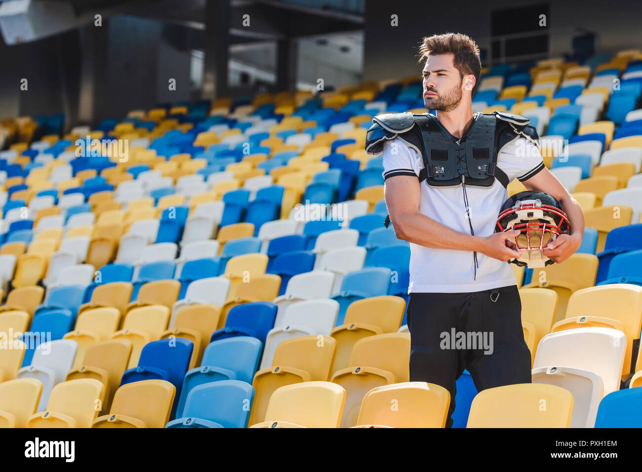 Man standing alone in stadium hi-res stock photography and images - Alamy