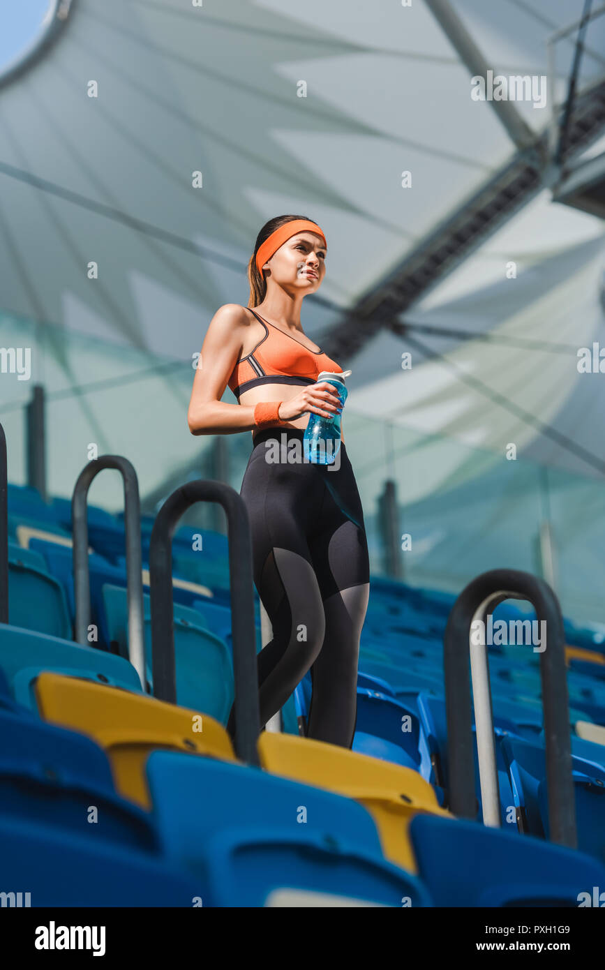 Woman at bottom of stairs hi-res stock photography and images - Alamy