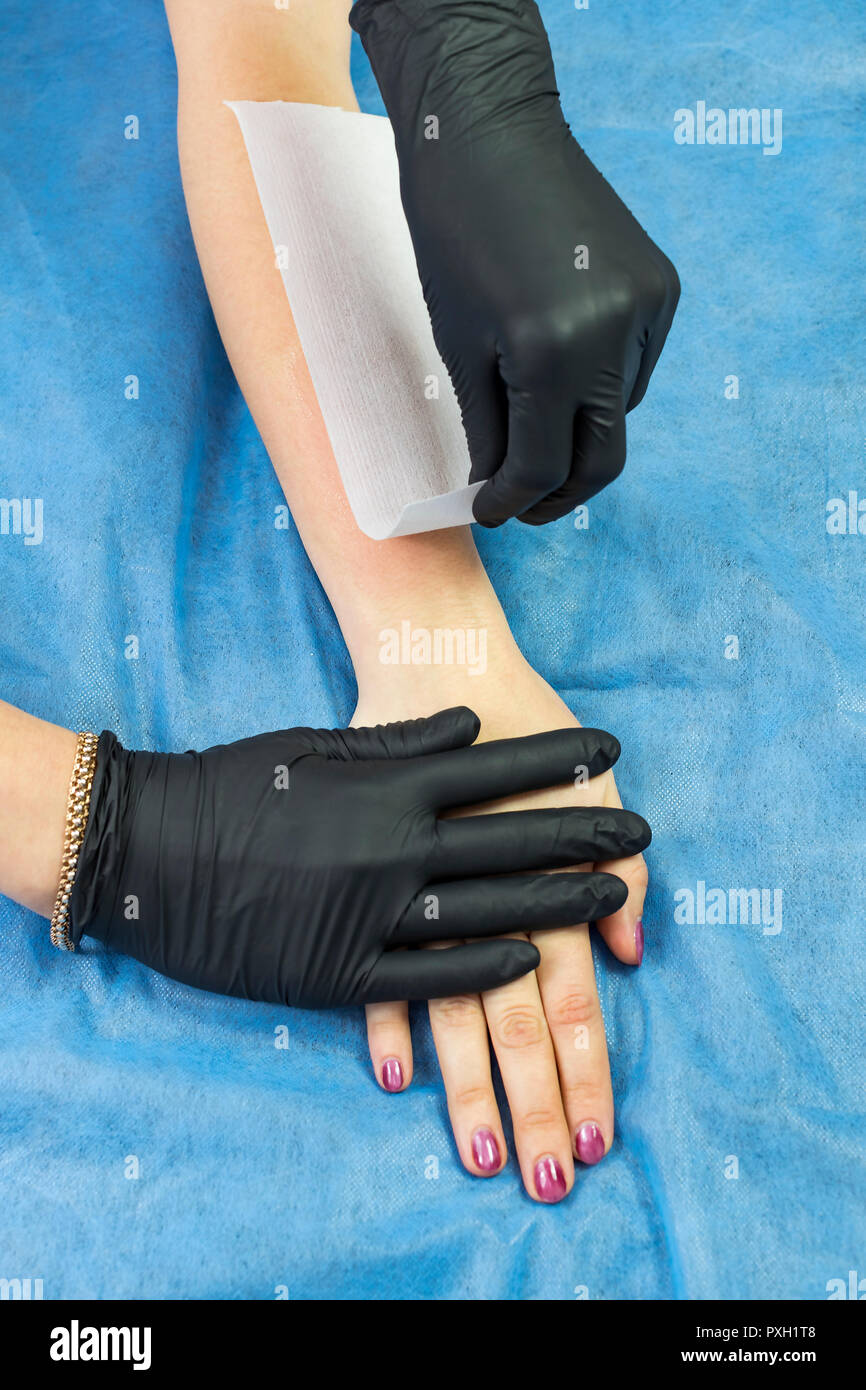 Process depilation female legs and hands in a beauty salon Stock Photo ...